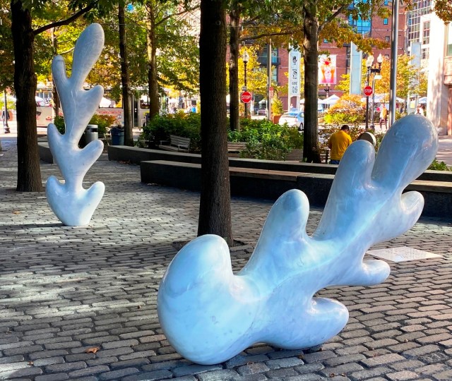 Large Marble Leaves by Claudia Comte Shine beneath Tall Oak Trees in ...